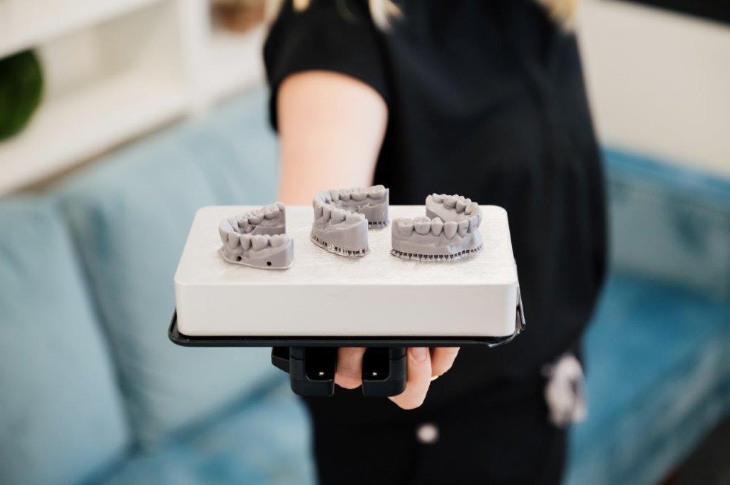 Boulder dentist Dr Andrea Schmidt showing 3D printed dental models at ...